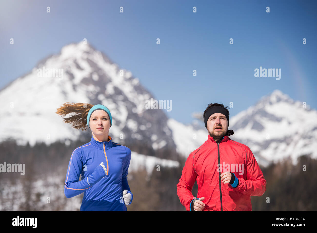 Young couple jogging Stock Photo - Alamy