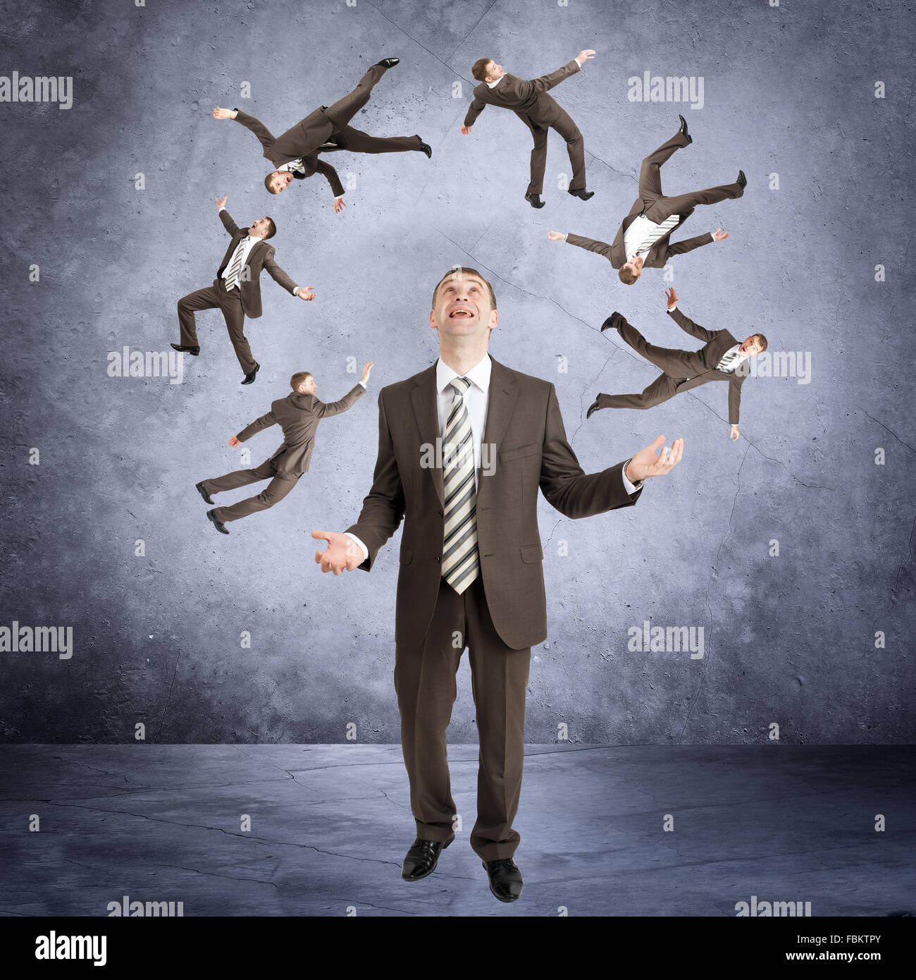 Businessman juggling little people Stock Photo - Alamy