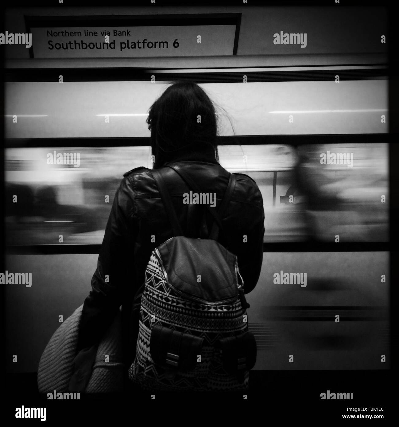 Woman at train station hi-res stock photography and images - Alamy