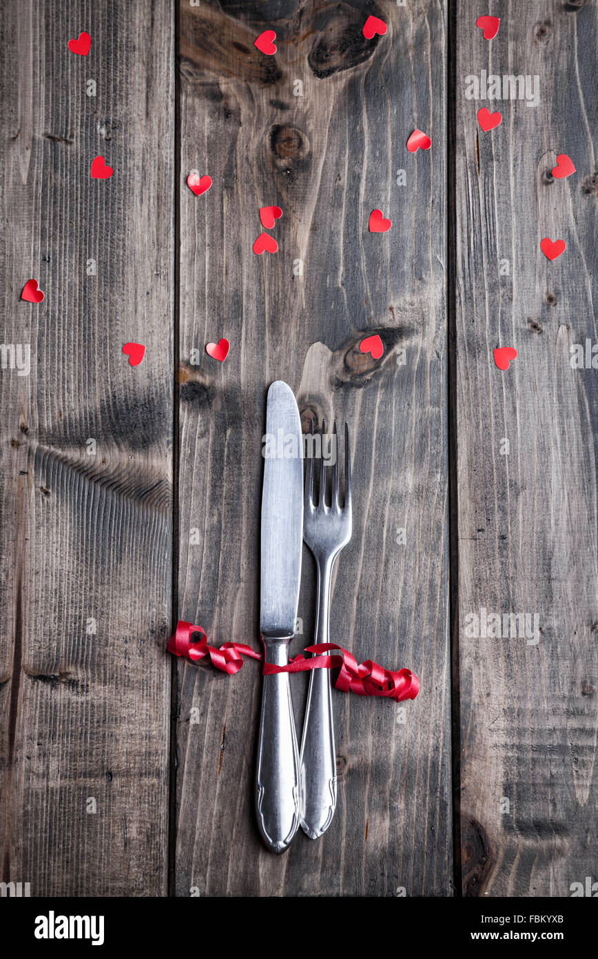 Romantic dinner set on rustic wooden background Stock Photo - Alamy