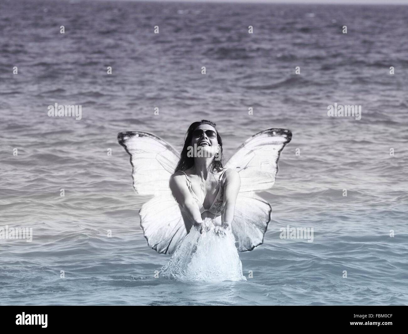 Woman angel wings sea hi-res stock photography and images - Alamy
