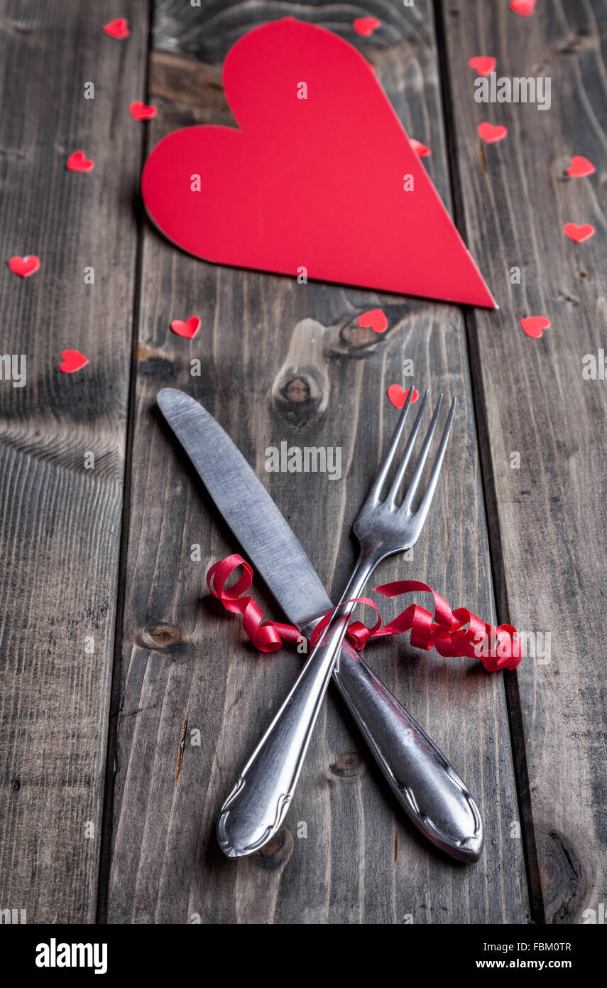 Romantic dinner set on rustic wooden background Stock Photo - Alamy