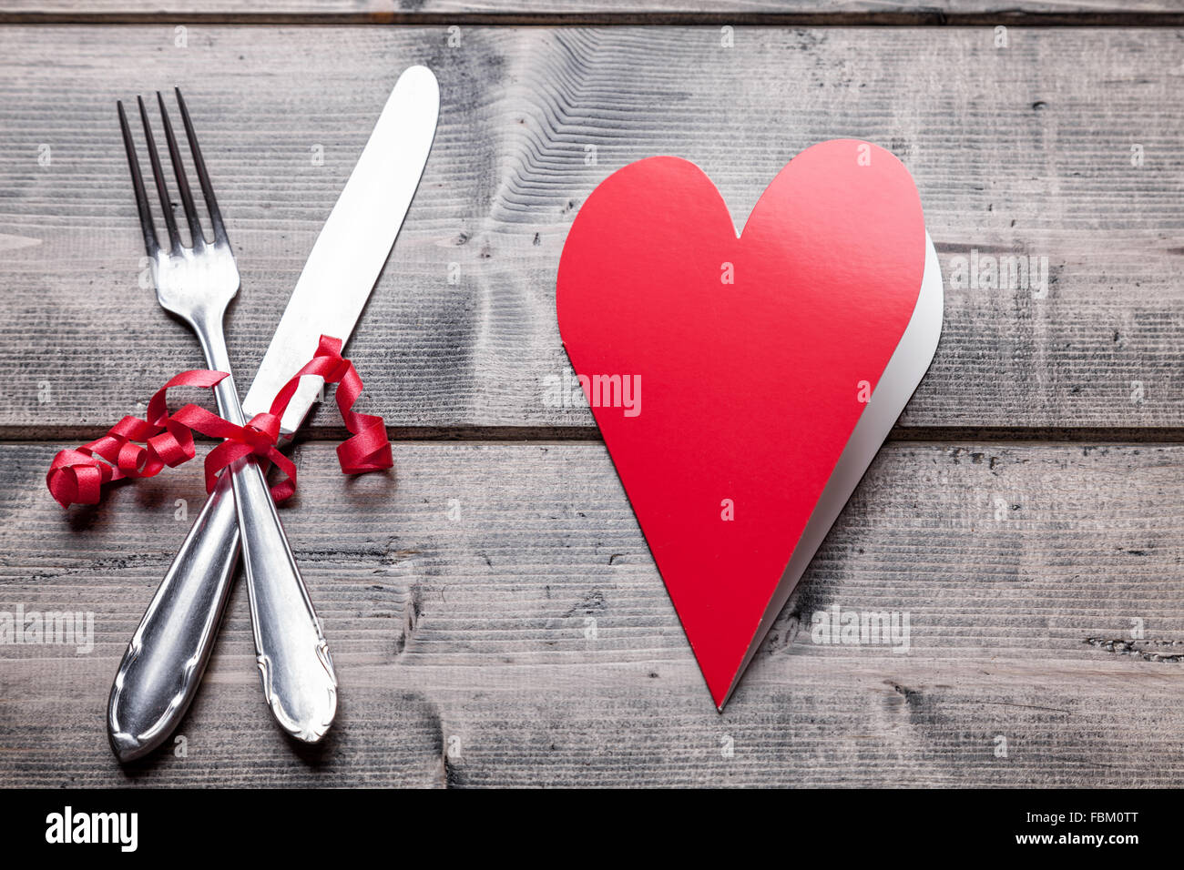 Romantic dinner set on rustic wooden background Stock Photo - Alamy