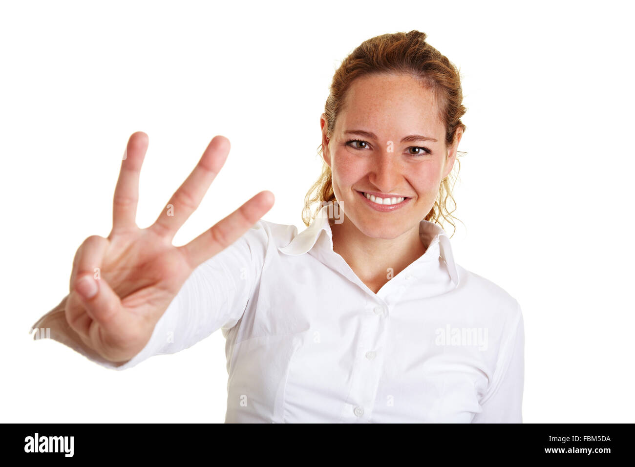 Smiling business woman showing three fingers of one hand Stock Photo ...