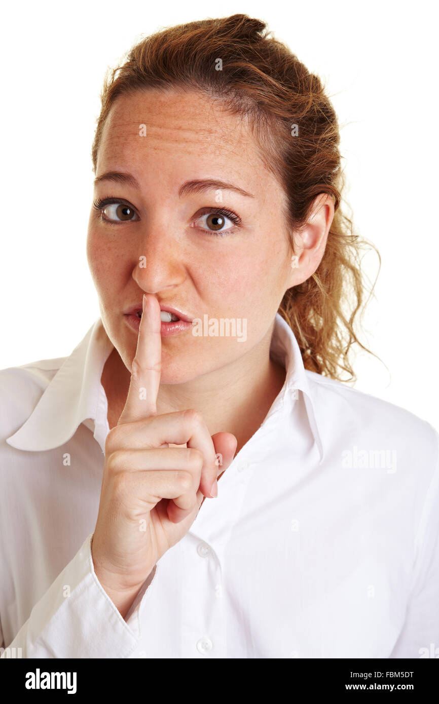 Business woman holding her index finger in front of her mouth Stock ...