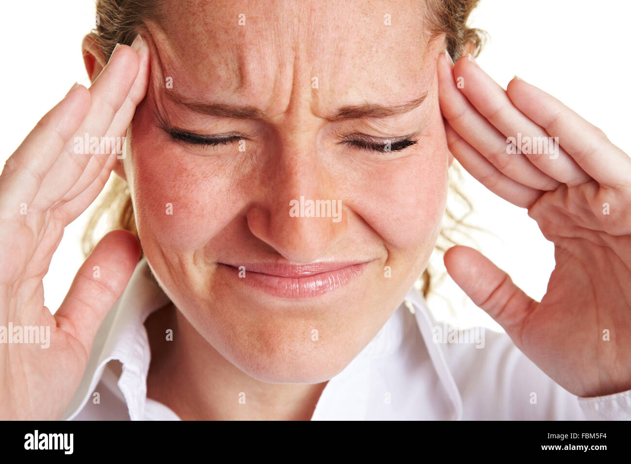 Business woman with headache massaging her aching temples Stock Photo ...