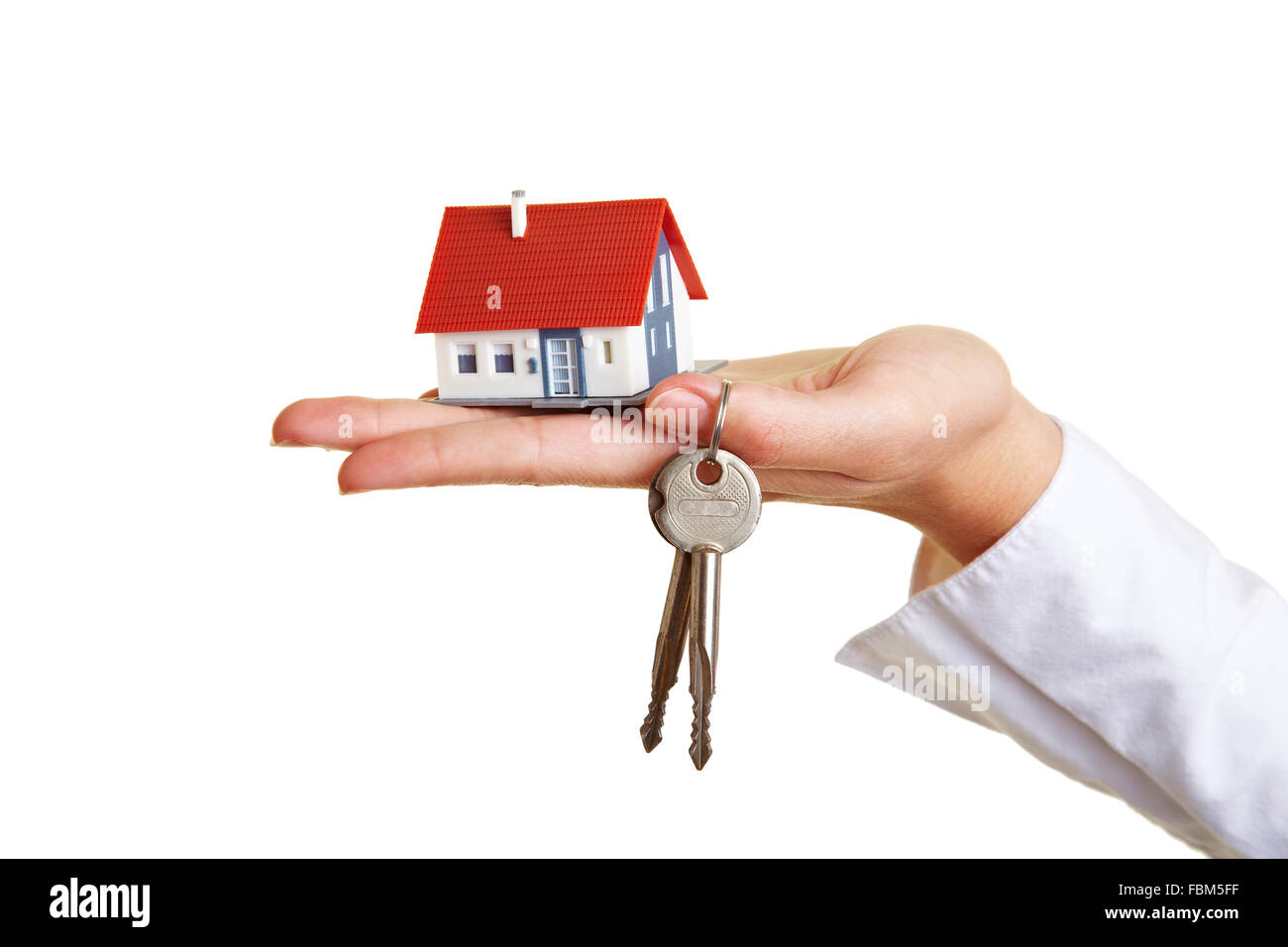 Small house and keys on palm of hand Stock Photo - Alamy
