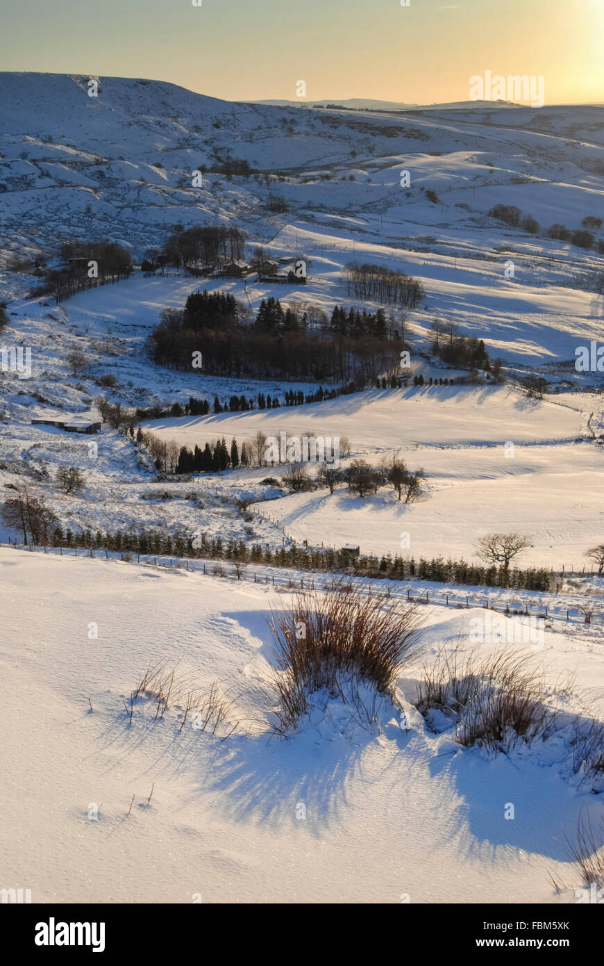 Late afternoon sunlight on a snowy landscape in Northern England. View ...