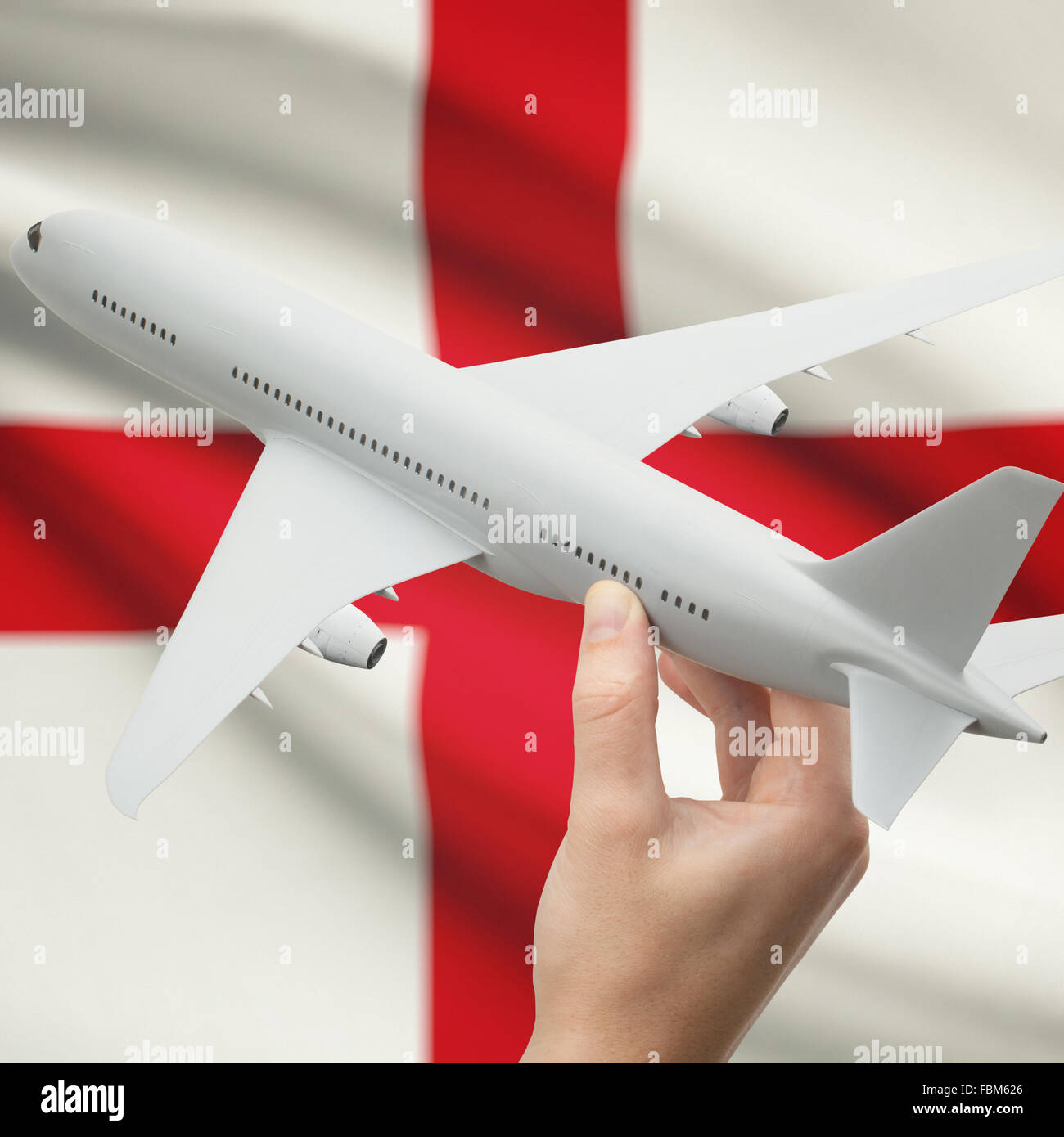 Airplane in hand with national flag on background series - England ...