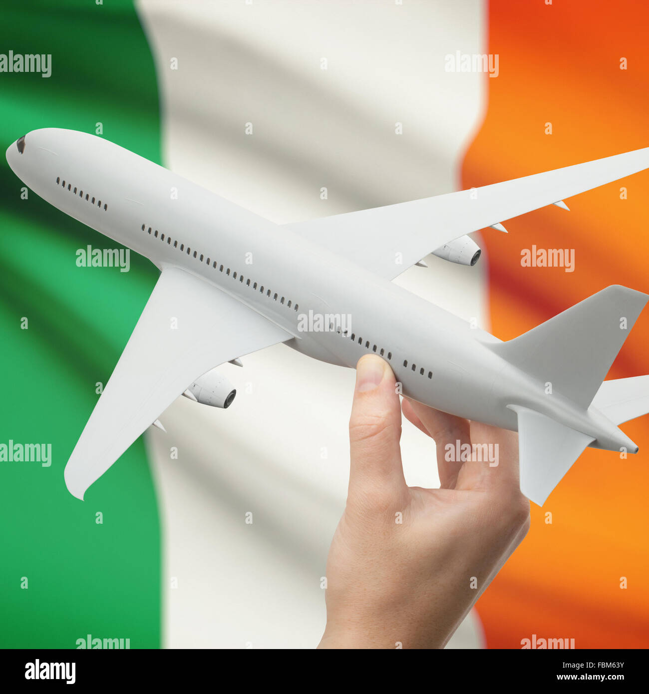 Airplane in hand with national flag on background series - Ireland ...