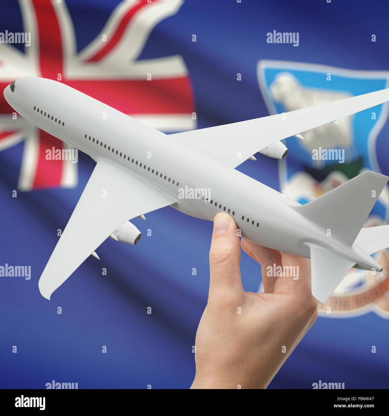 Airplane in hand with national flag on background series - Falkland ...