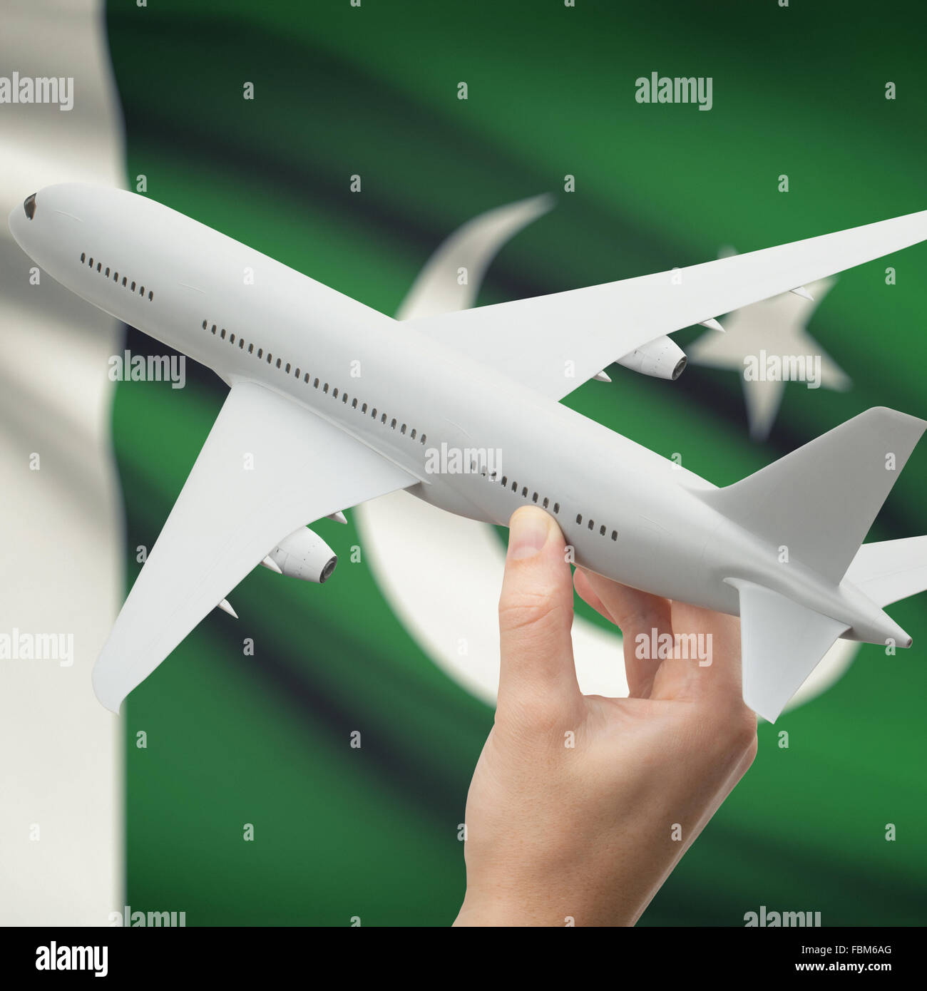 Airplane in hand with national flag on background series - Pakistan ...