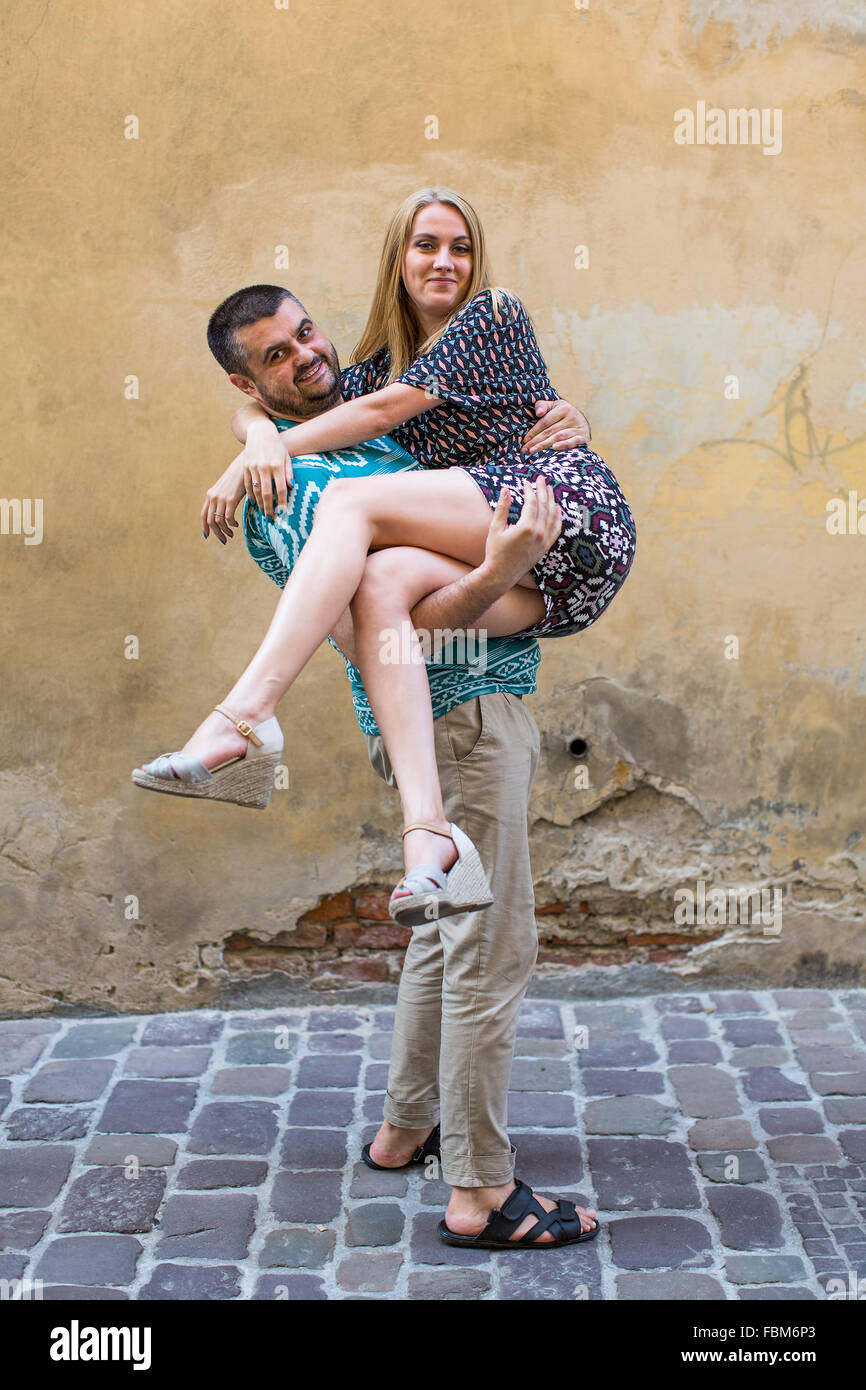 Guy Carrying Girl In Arms