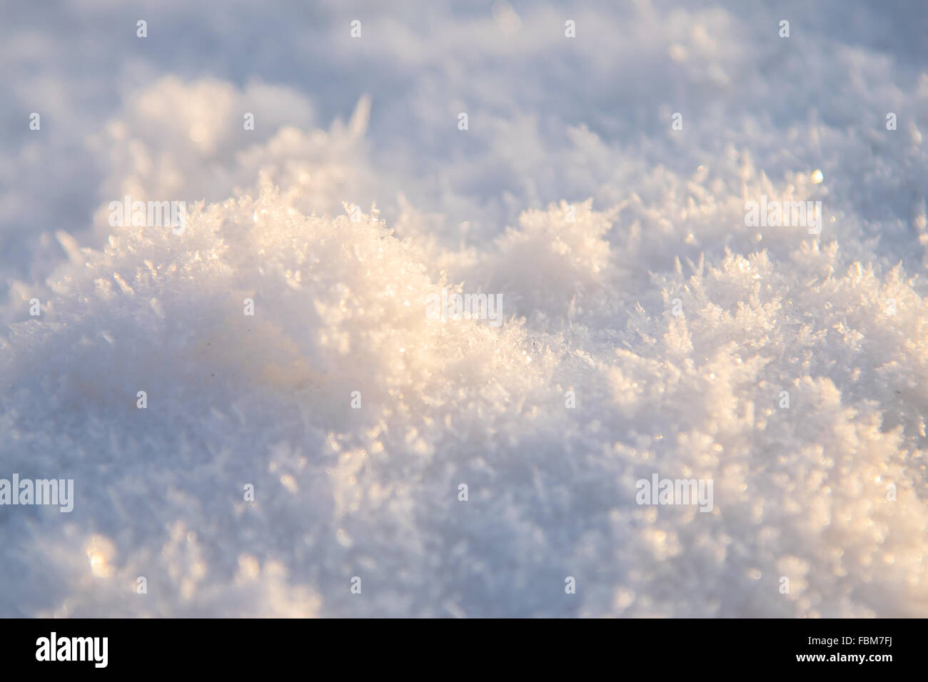 Sunlit snow surface Stock Photo - Alamy