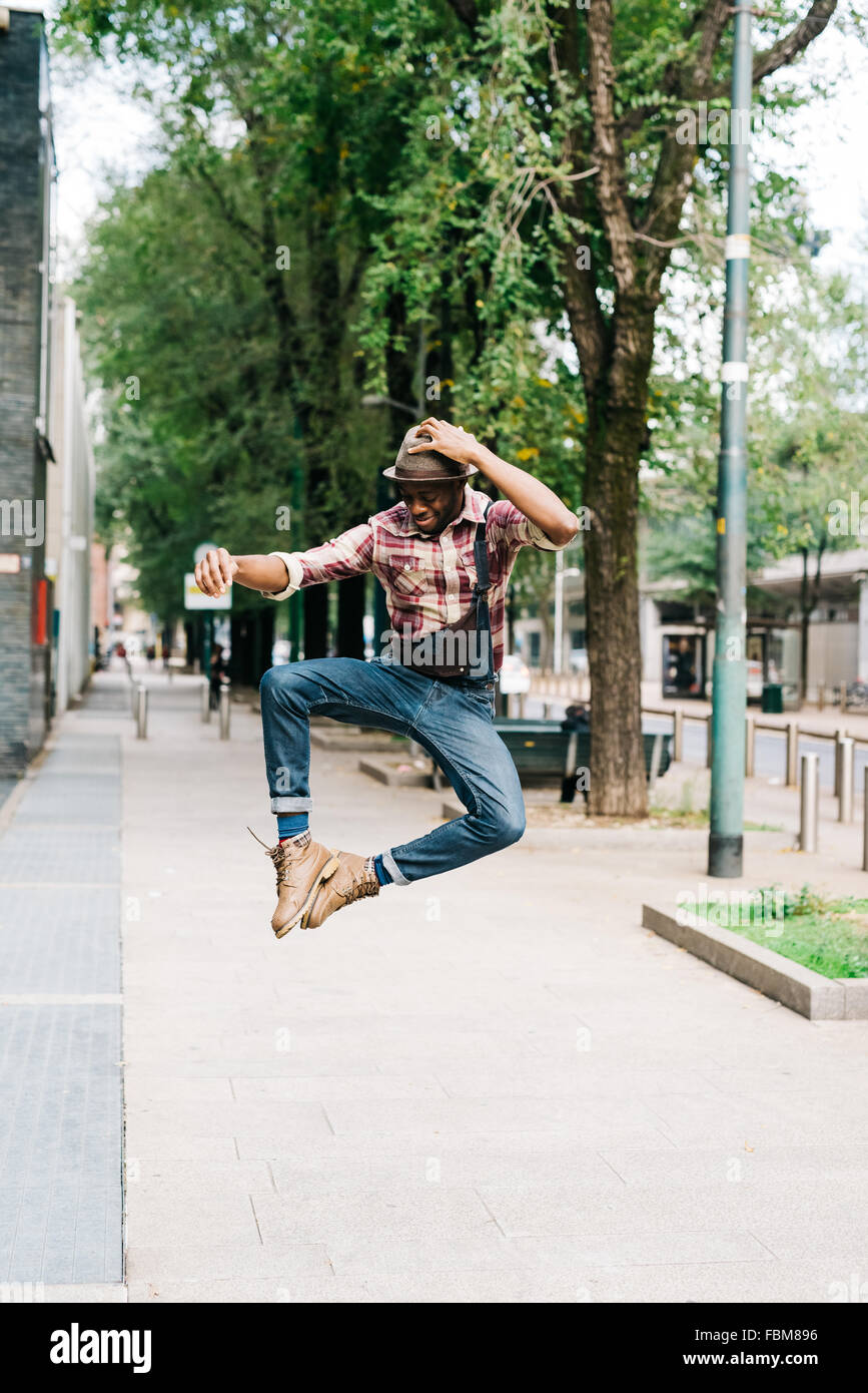 Handsome jumping young man hi-res stock photography and images - Alamy