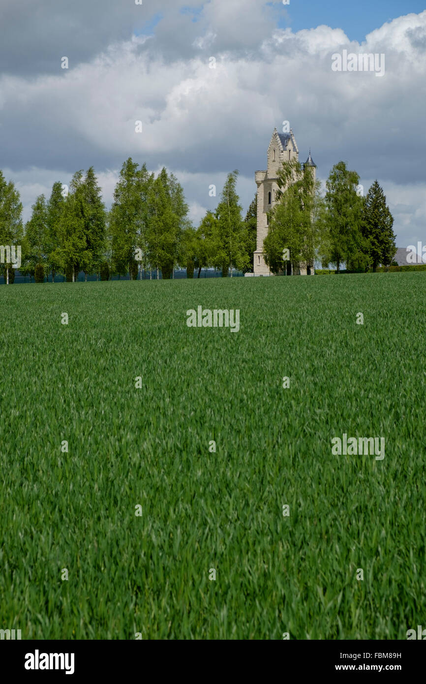 Distant view of The Ulster Memorial Tower, Somme. France across a green ...