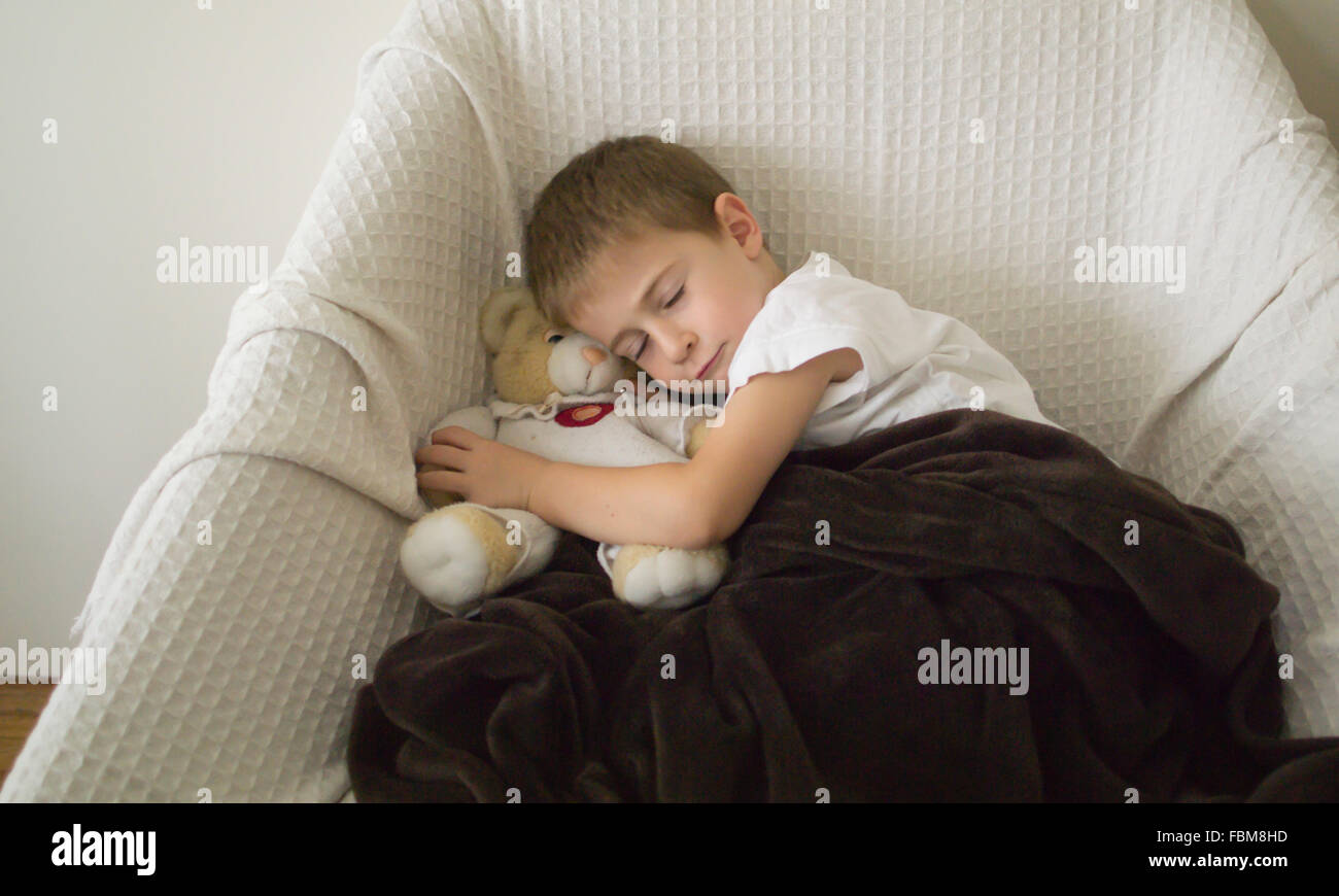 Boy sleeping with teddy hi-res stock photography and images - Alamy
