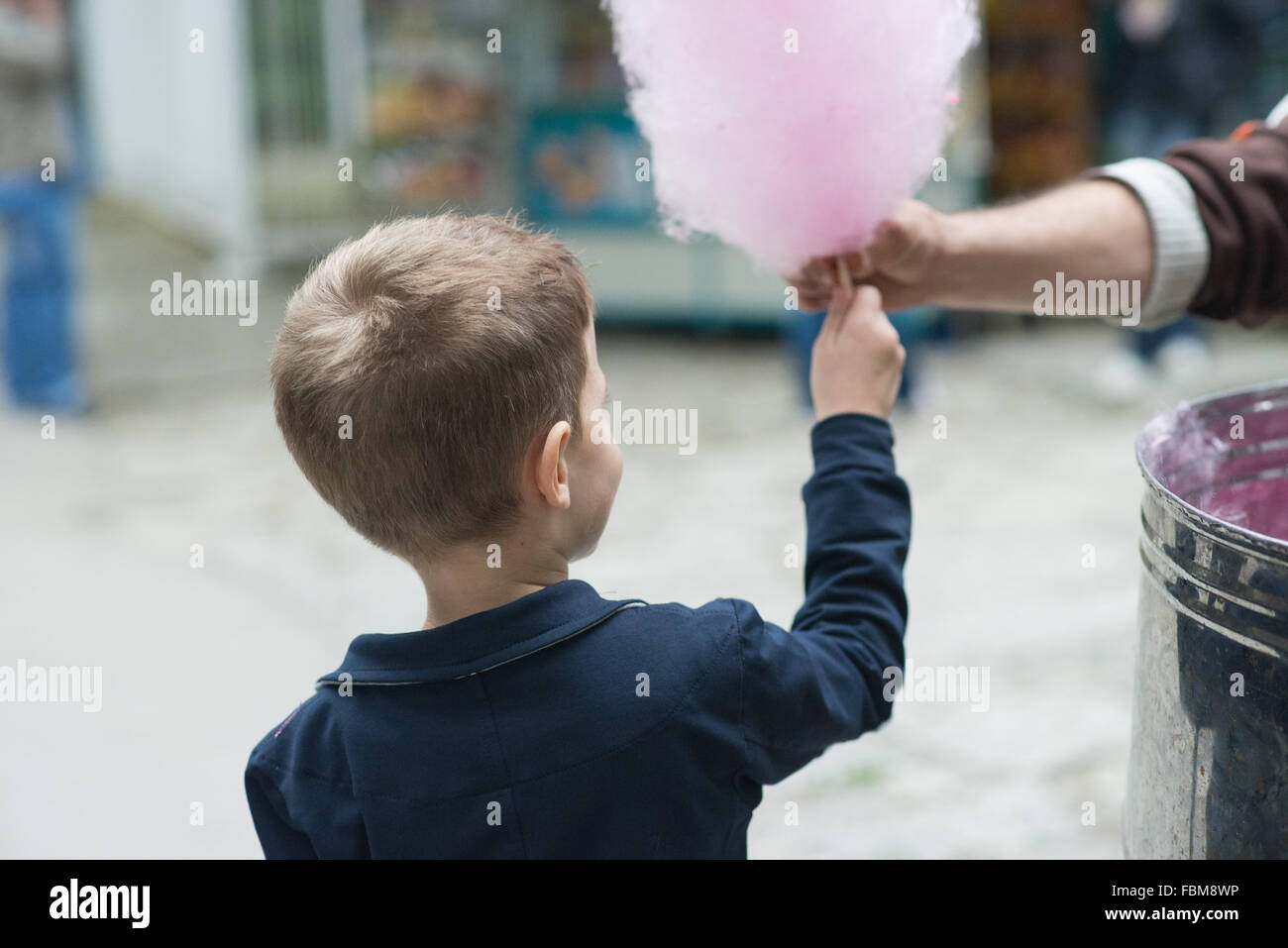 Boy holding candy cotton Stock Photo - Alamy