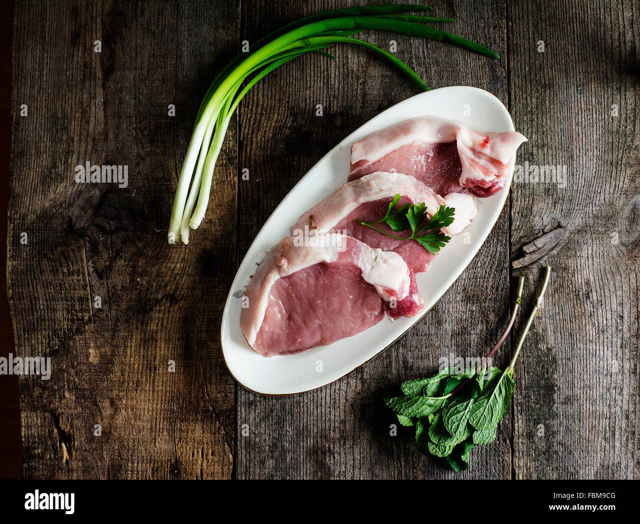 Pork chops on a plate Stock Photo - Alamy