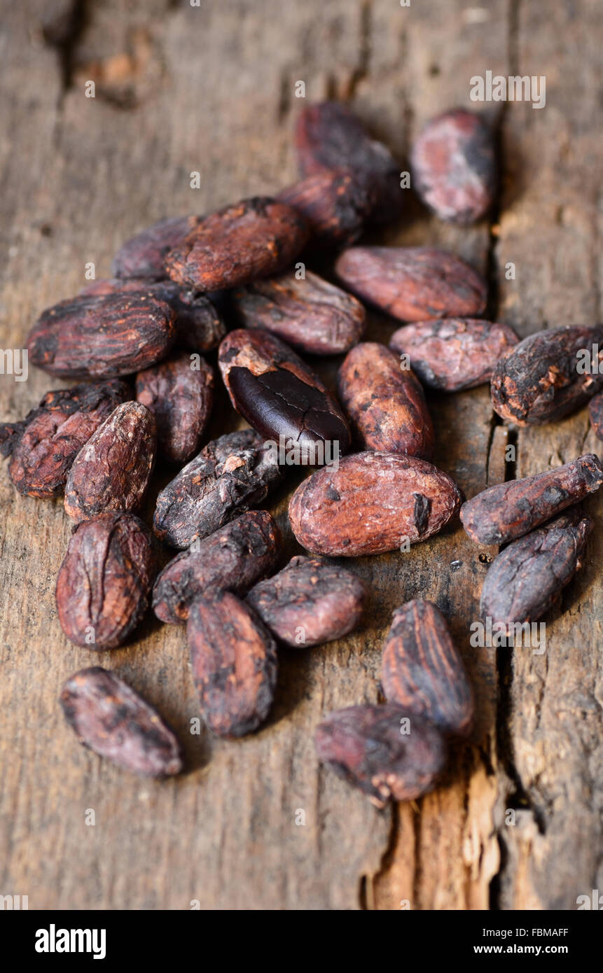 Raw Cocoa beans on a dark background Stock Photo - Alamy