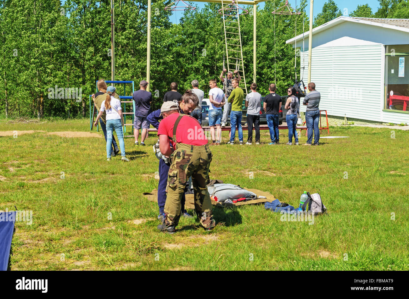 Parachutists - 2015. Girl to prepare to jump on a parachute tandem ...
