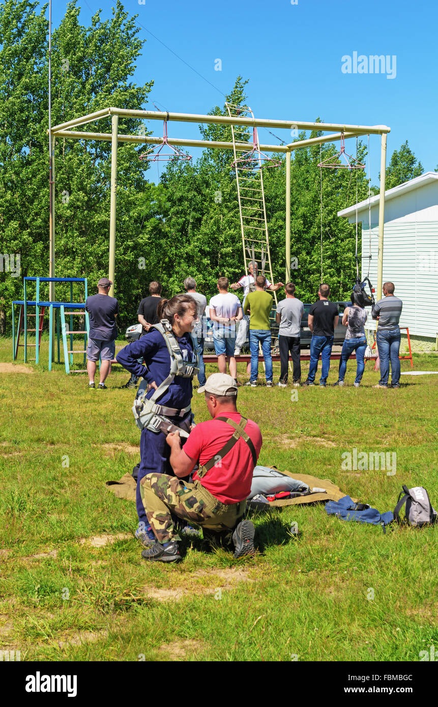 Parachutists - 2015. Girl to prepare to jump on a parachute tandem ...
