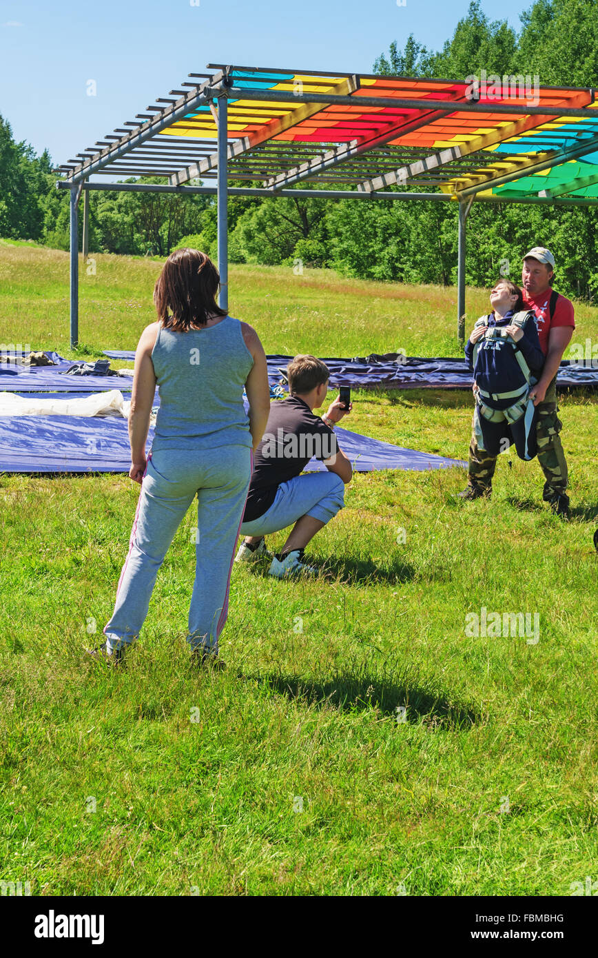 Parachutists - 2015. Girl to prepare to jump on a parachute tandem ...
