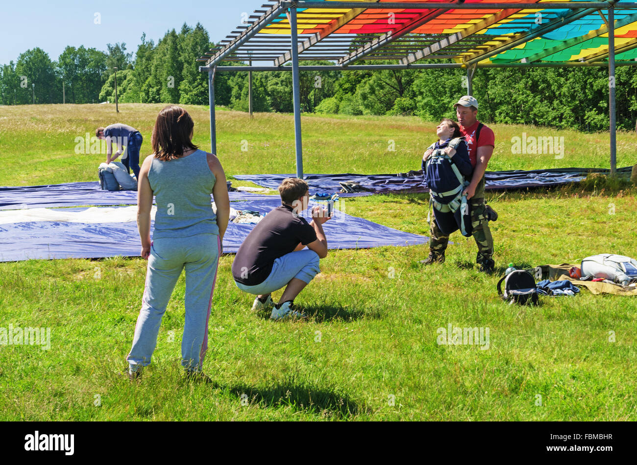 Parachutists - 2015. Girl to prepare to jump on a parachute tandem ...