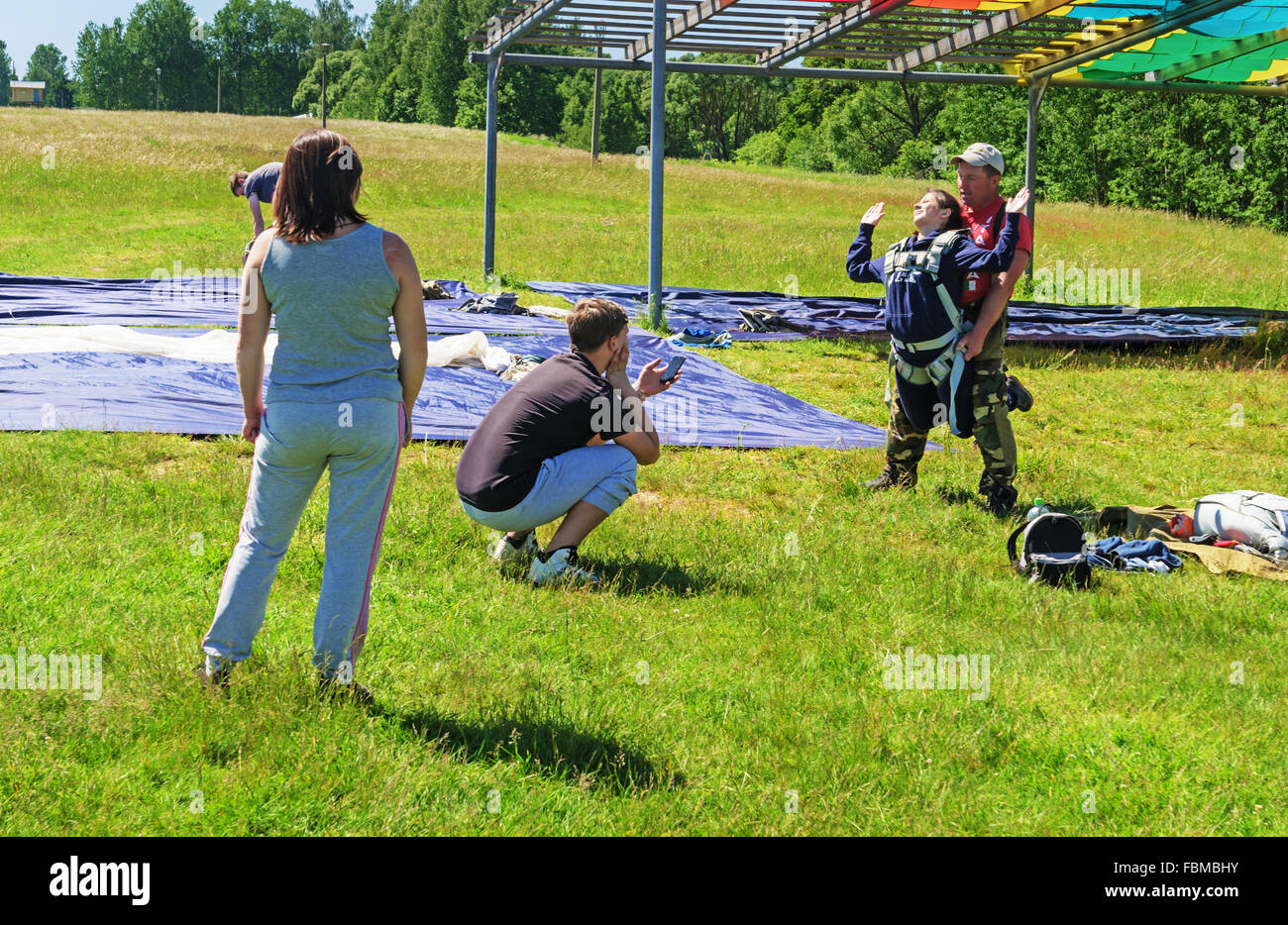 Parachutists - 2015. Girl to prepare to jump on a parachute tandem ...