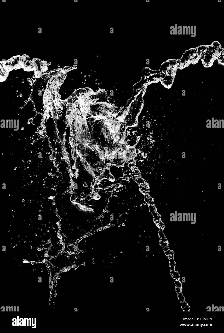 Splash of pouring water isolated over black background Stock Photo - Alamy