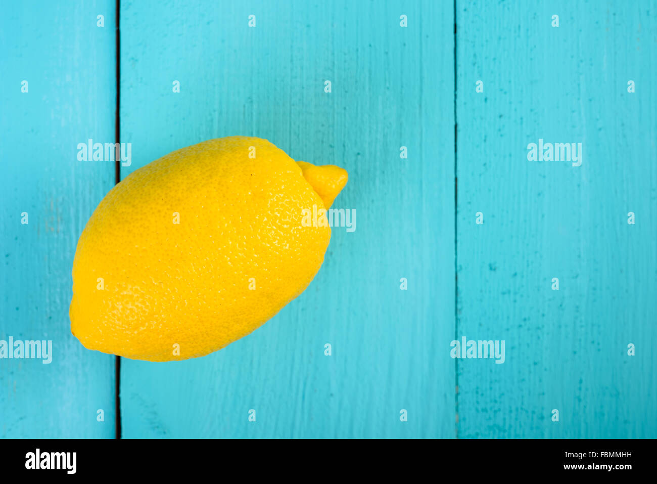 Fresh Yellow Lemon On Turquoise Wood Table Stock Photo - Alamy