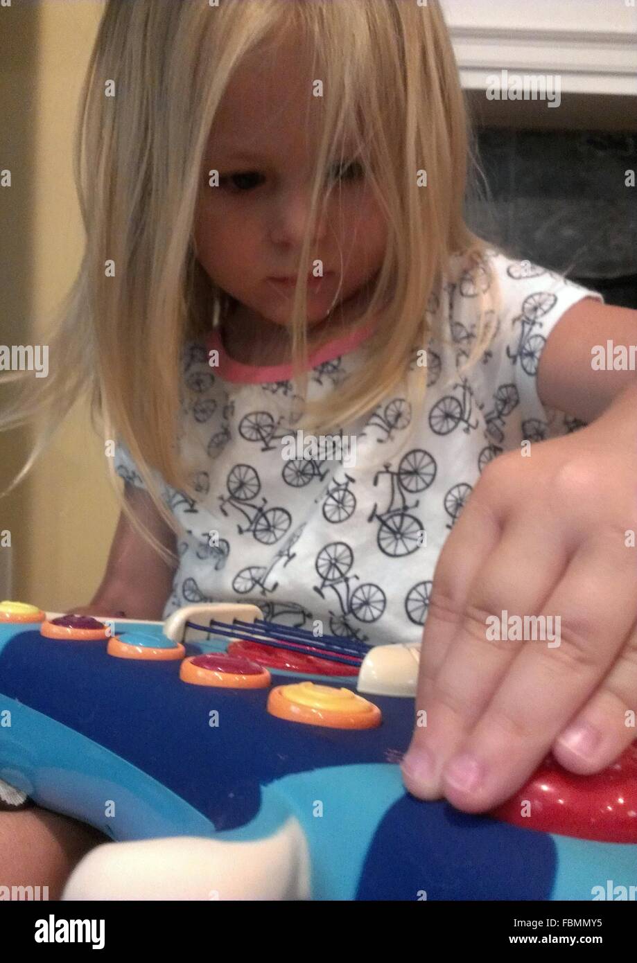 Girl with a toy hi-res stock photography and images - Alamy