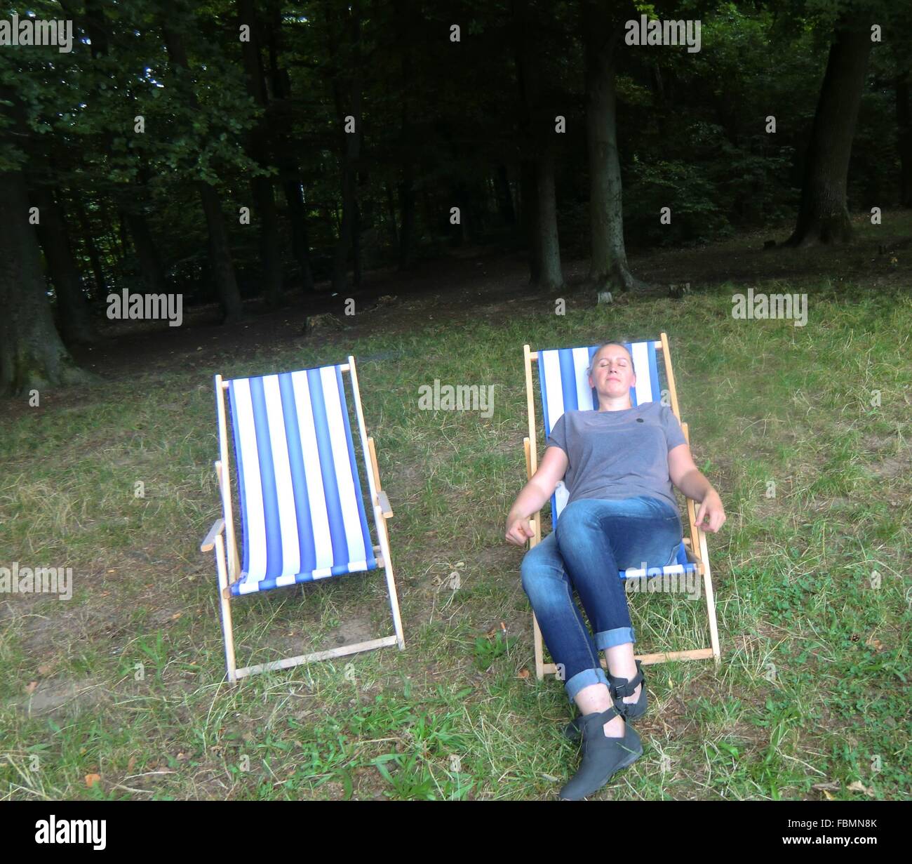 Reclining on chair hi-res stock photography and images - Alamy
