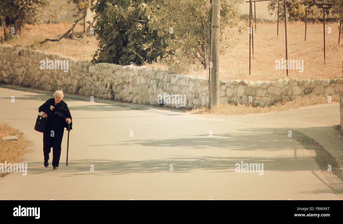Old lady walking stick hi-res stock photography and images - Alamy