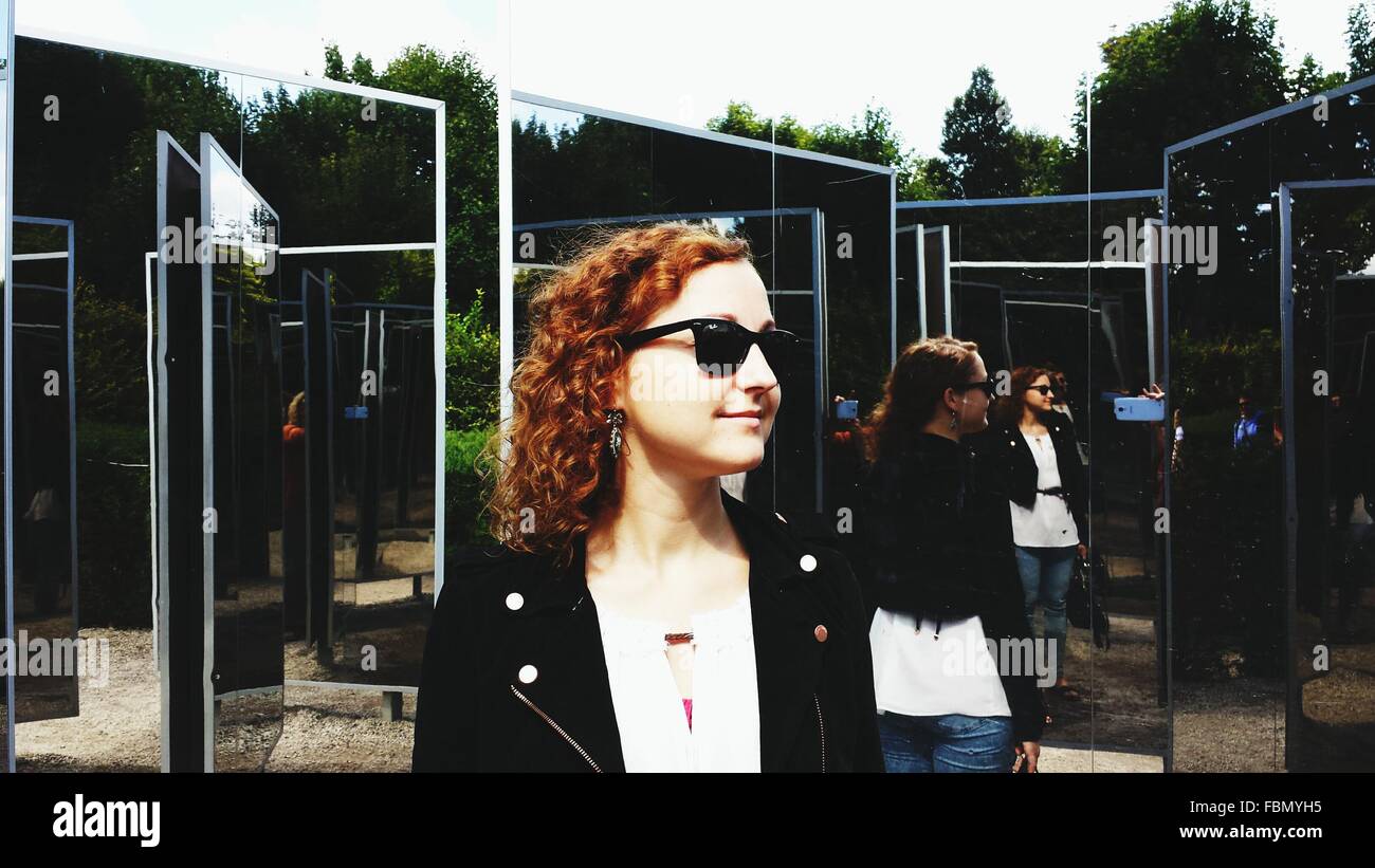 Reflection Of Woman In Mirrors Stock Photo - Alamy