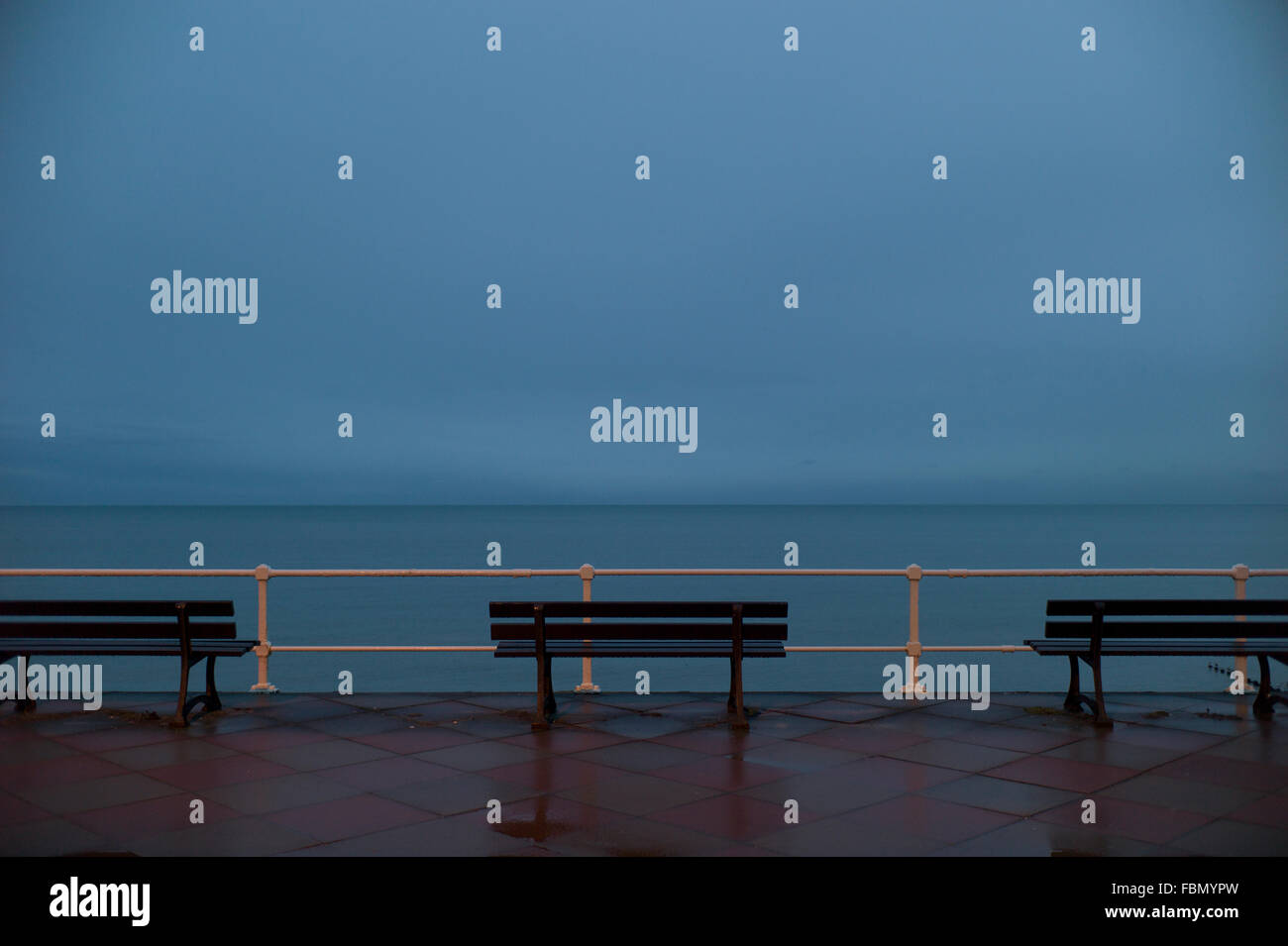 Seafront benches after rain Stock Photo - Alamy