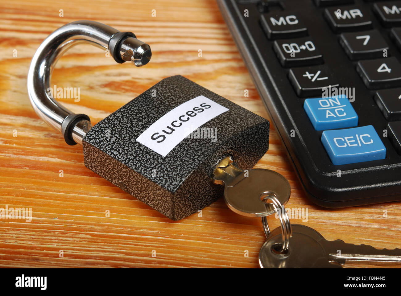 Lock with an inscription "success" with a key Stock Photo - Alamy