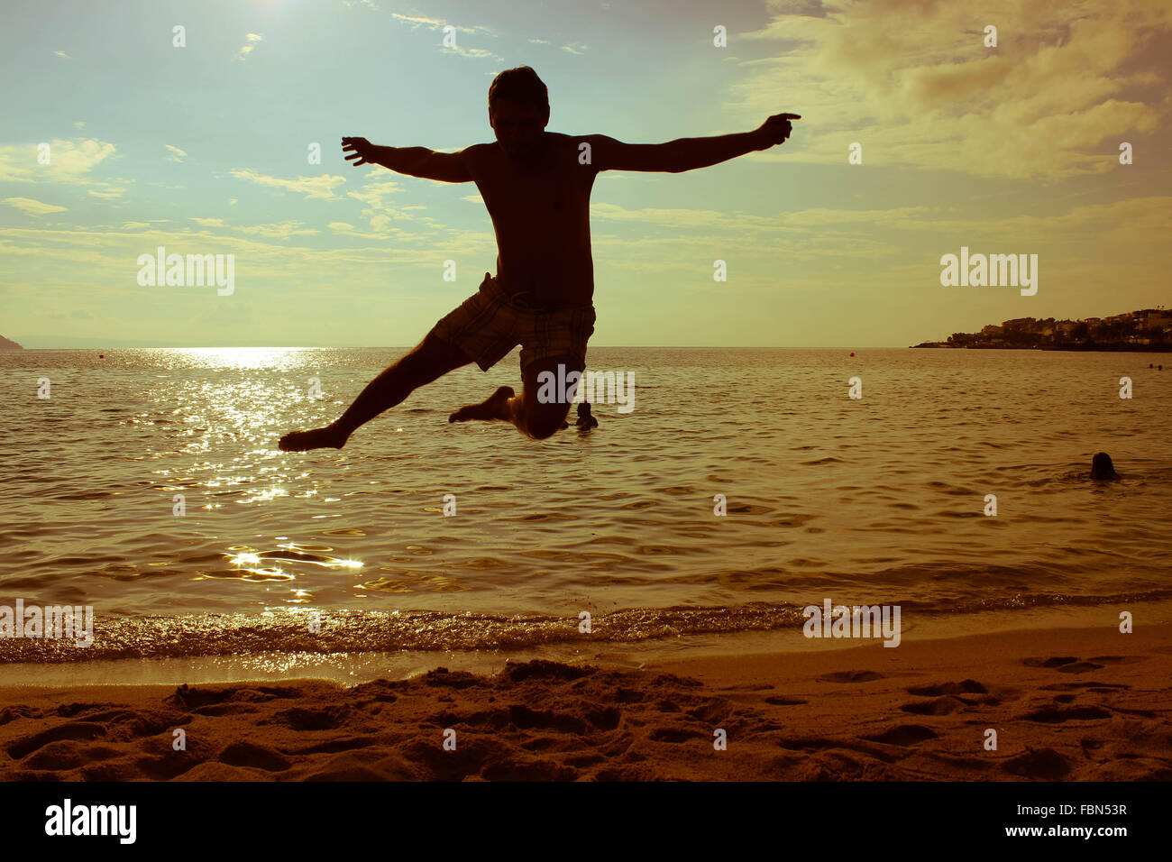 Jumping on the beach hi-res stock photography and images - Alamy