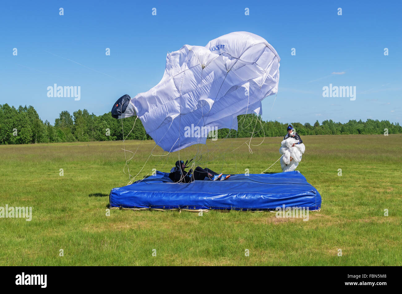 Parachutists - 2015.The skydiver landing under parachute Stock Photo ...