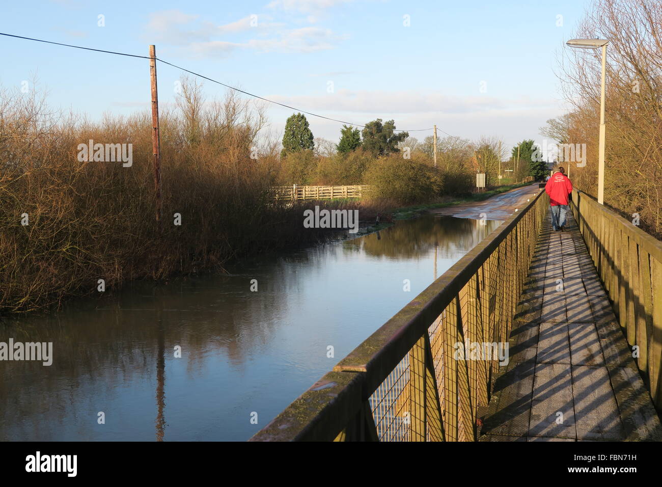 The footbridge crossing the Ouse Washes road at Sutton Gault Stock ...