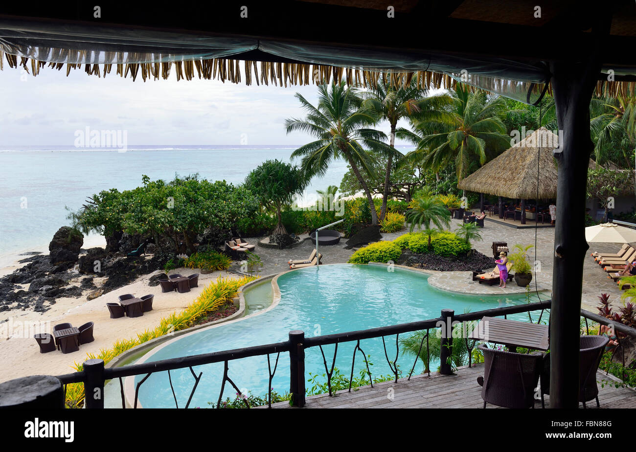 Guests relaxing by the infinity pool at Pacific Resort Aitutaki ...