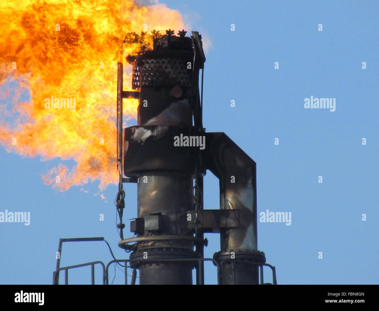 System of a torch on an oil field. Burning through a torch head Stock ...