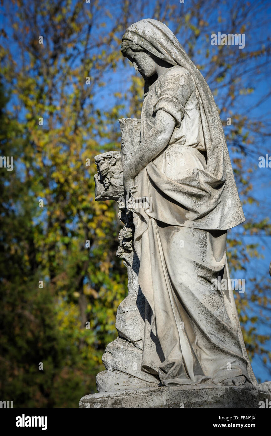 Stone cemetery statue Stock Photo - Alamy