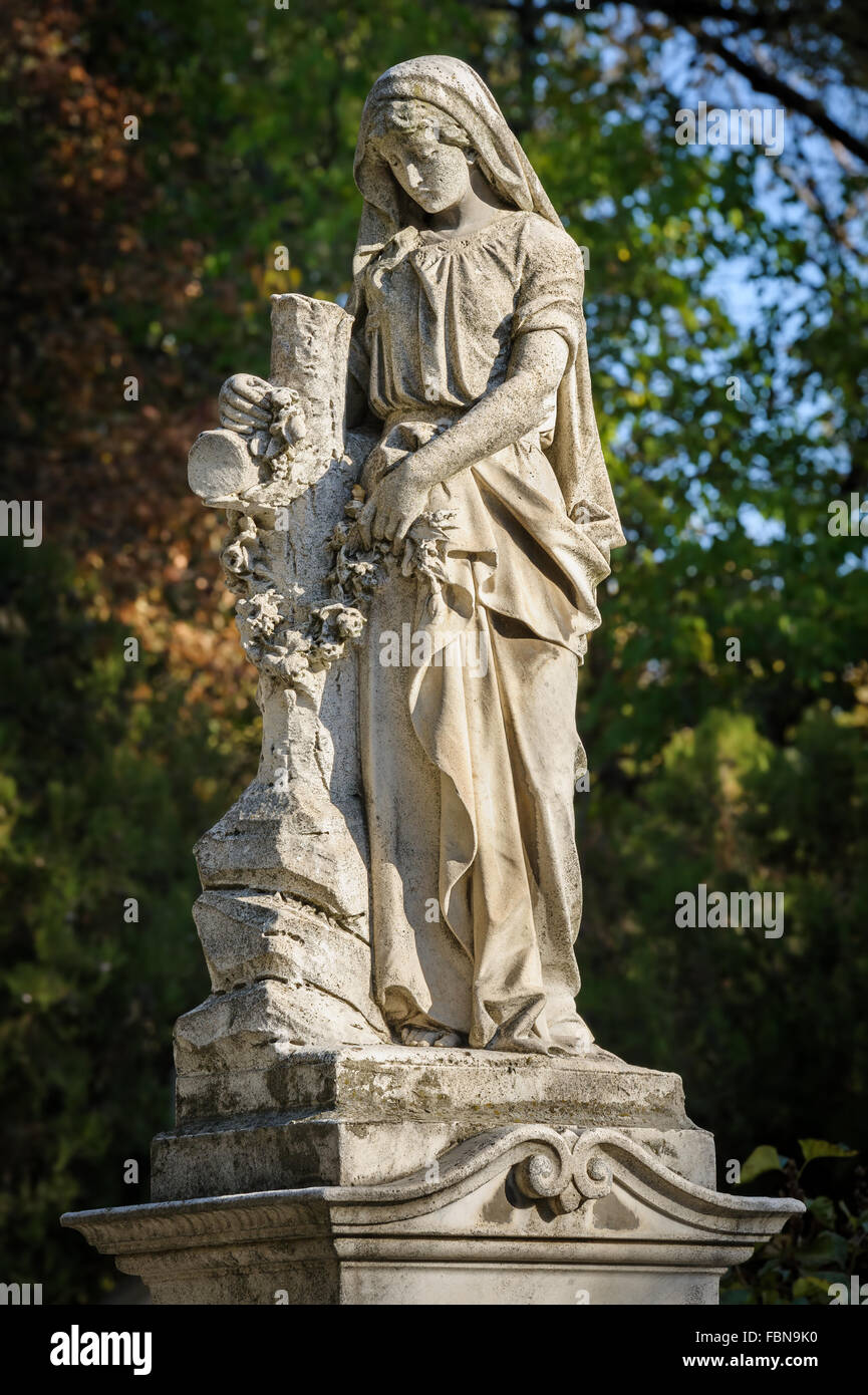 Stone cemetery statue Stock Photo - Alamy
