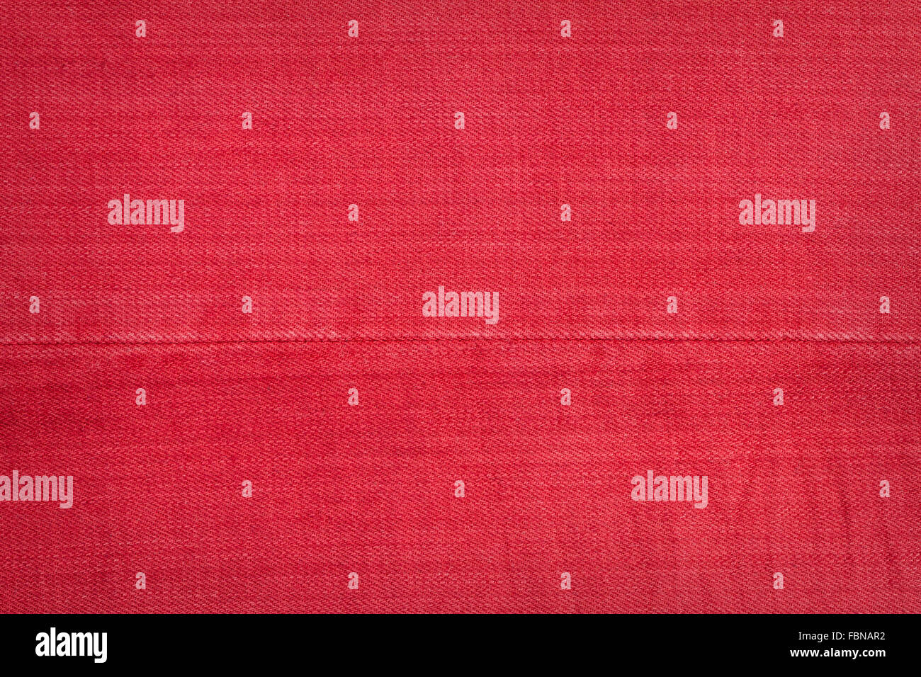 Red jeans texture wit a seam Stock Photo - Alamy