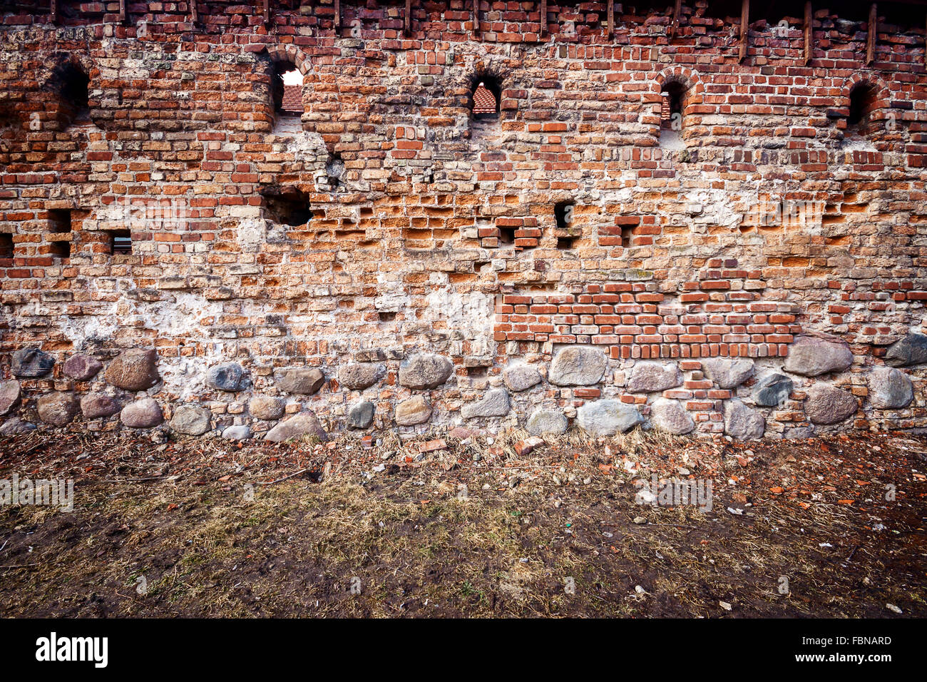 Wall of mixed materials - stone and bricks Stock Photo - Alamy