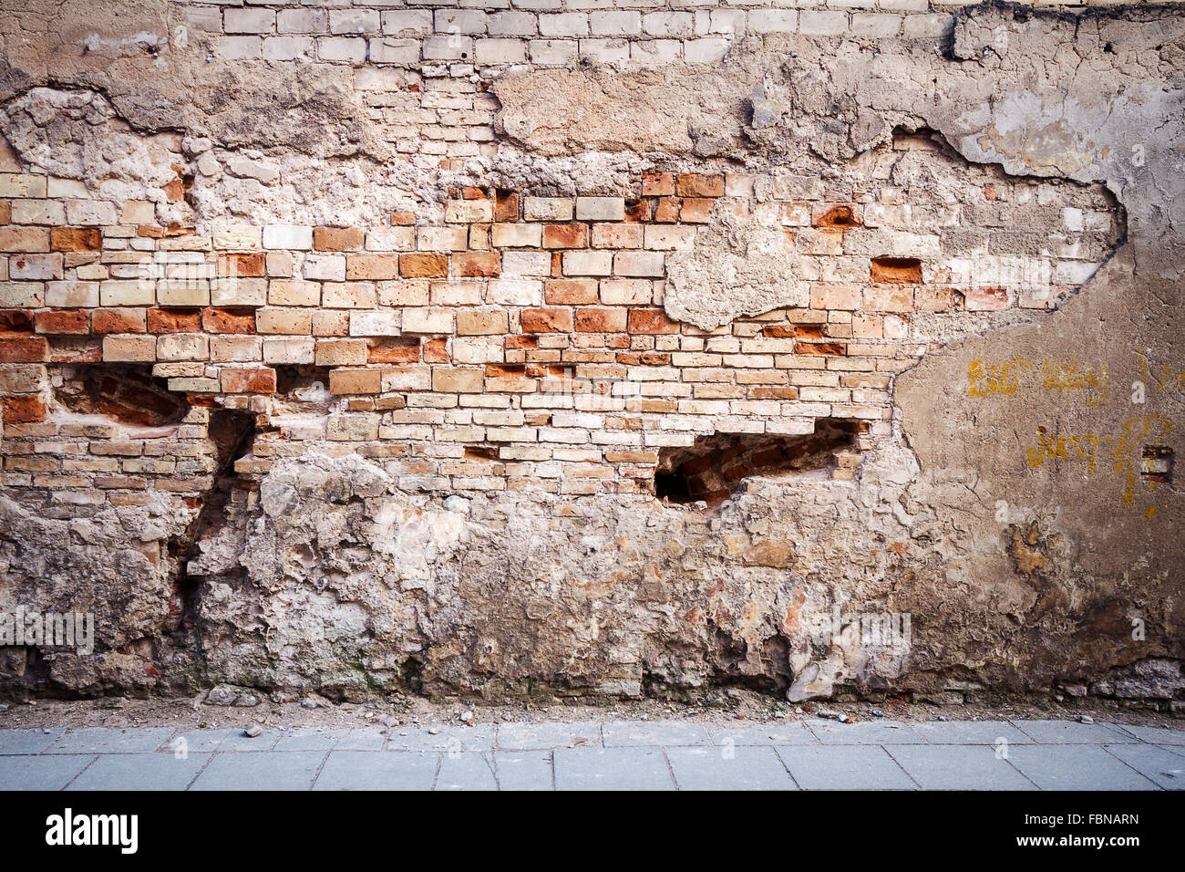 Old weathered wall of bricks and a ground Stock Photo - Alamy