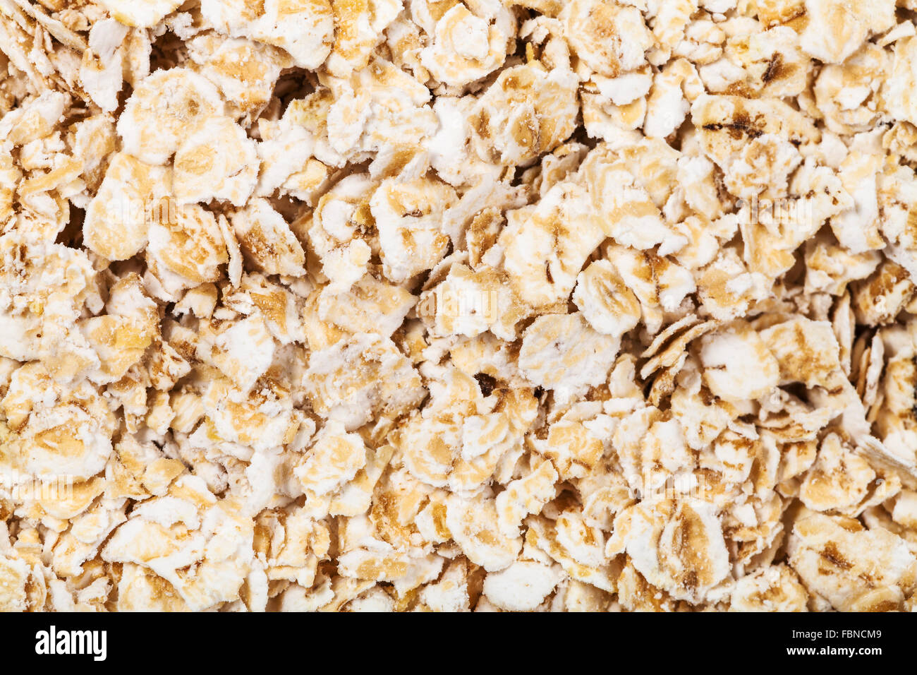 food background - dry oat flakes close up Stock Photo - Alamy