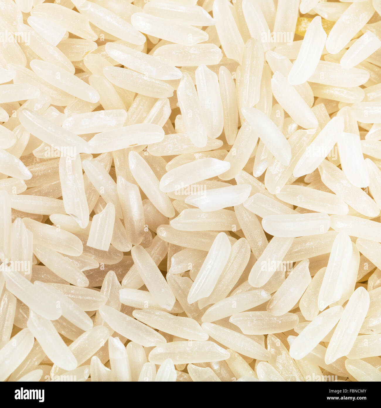 square food background - long-grain uncooked white jasmine rice Stock ...