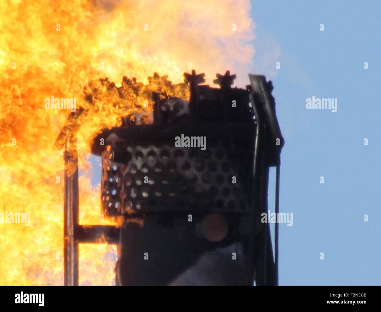 System of a torch on an oil field. Burning through a torch head Stock ...
